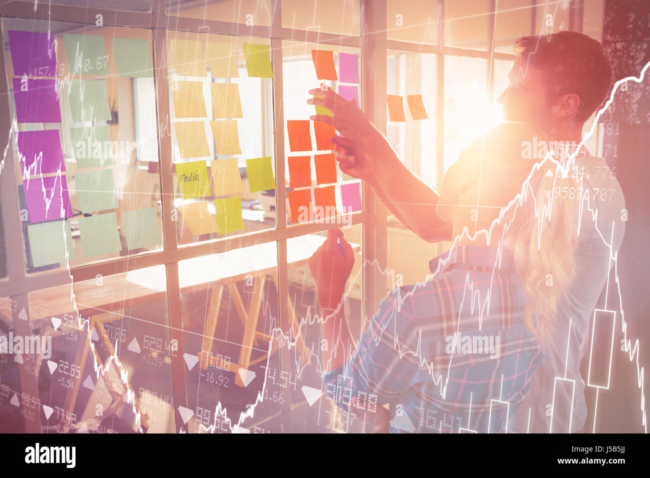 Stocks and shares against young creative business people Stock Photo ...