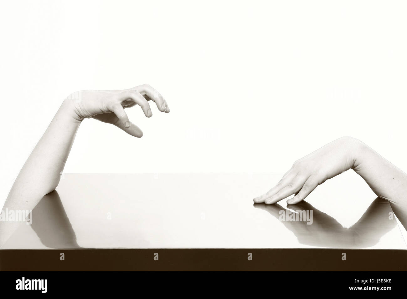 hand hands finger mirroring reflection claws grasp table top brachial ...