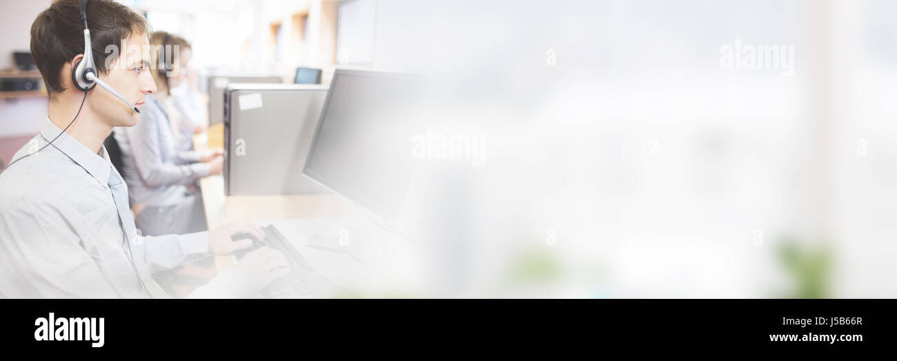 Side view of serious operator using computer in office Stock Photo - Alamy