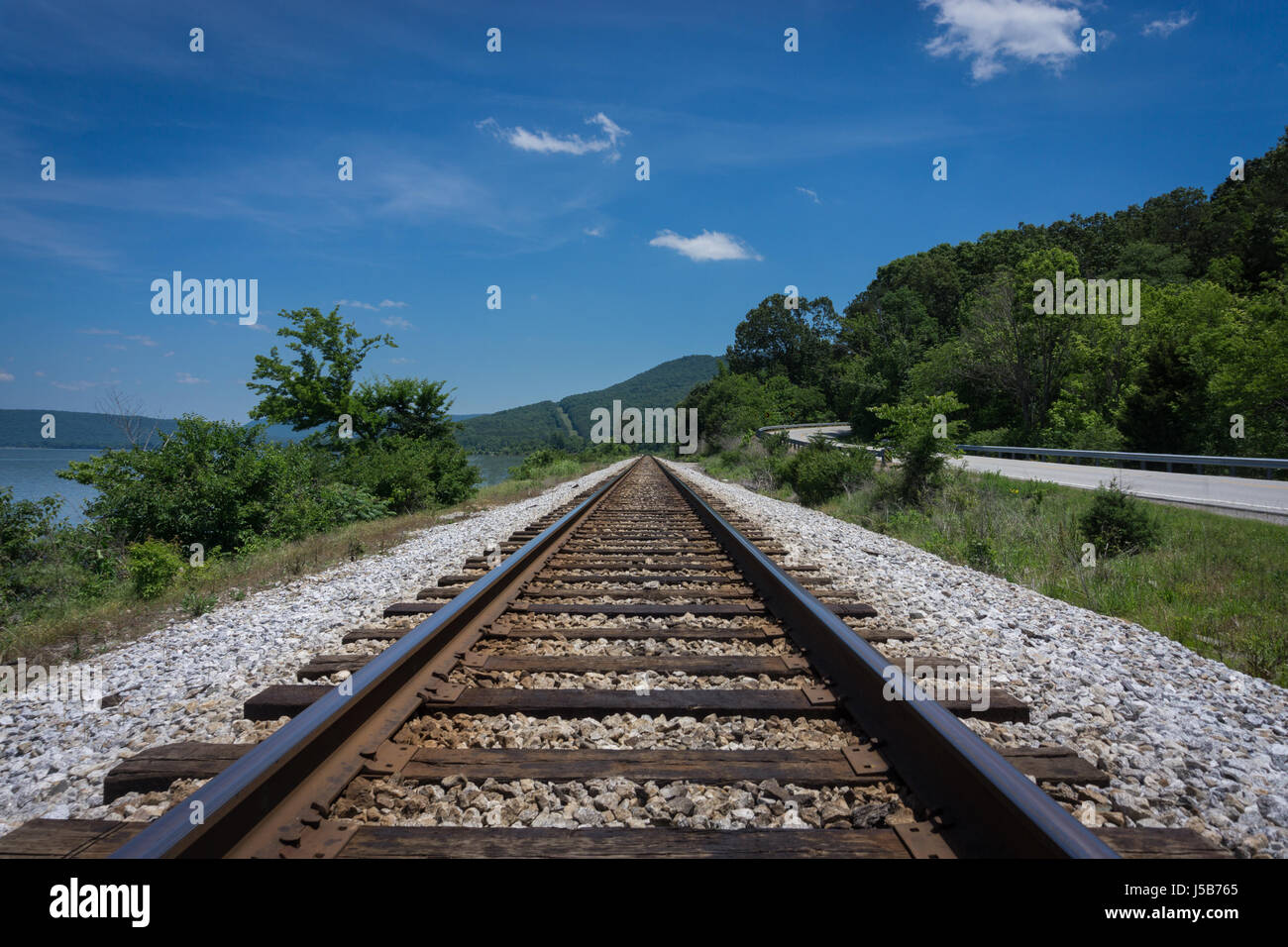 Railroad Tracks to Distant Mountain Stock Photo - Alamy