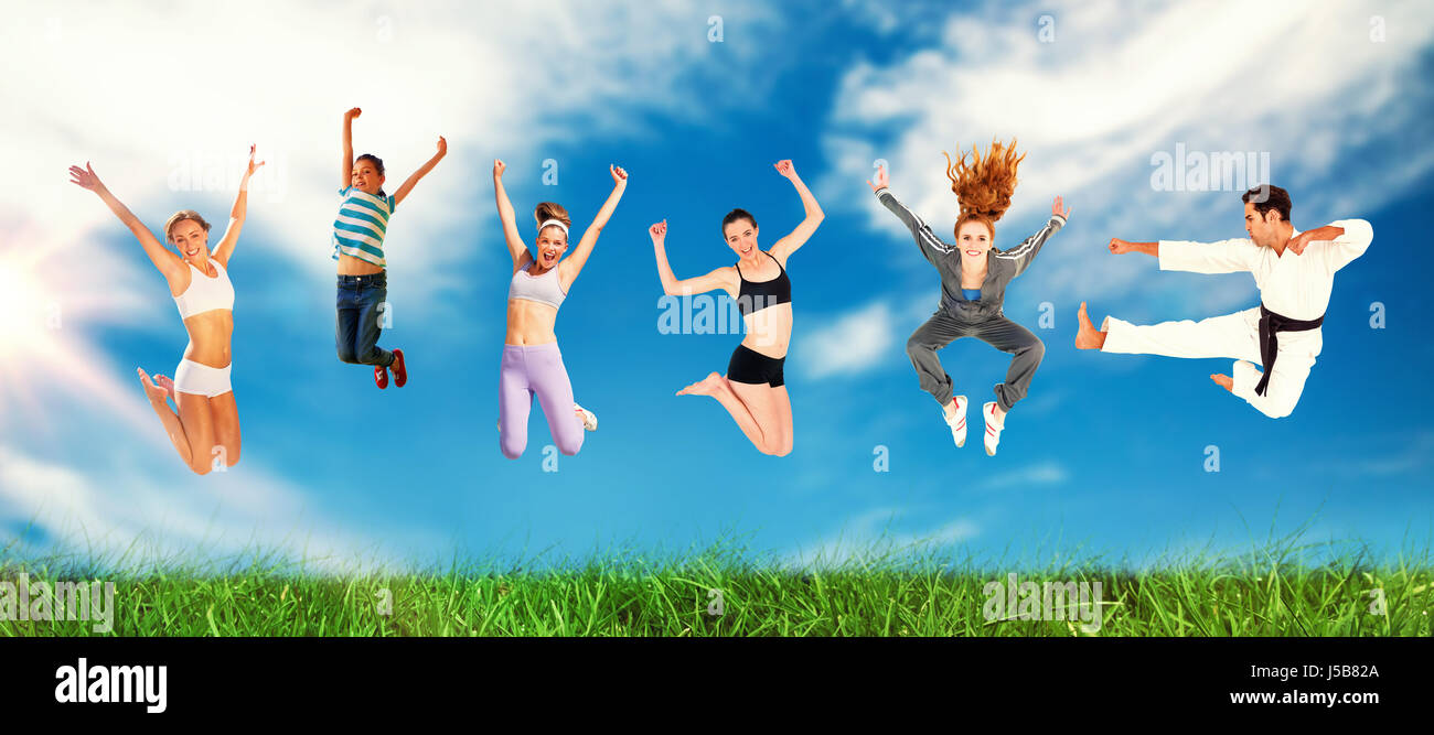 Man and women jumping over white background against view of a blue sky ...