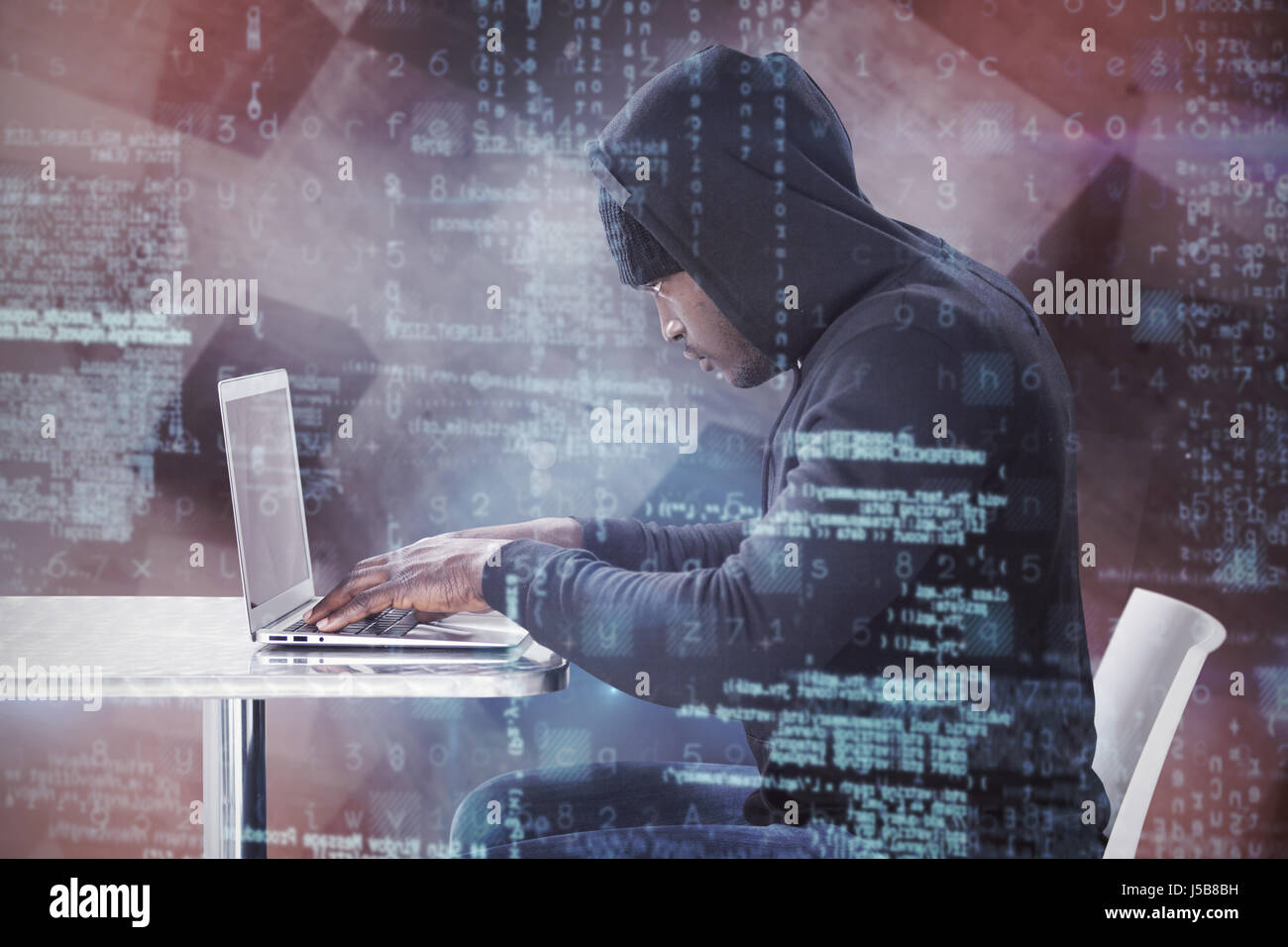 Side view of male hacker using laptop against abstract room Stock Photo ...