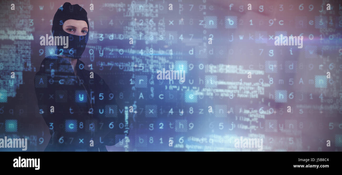 Portrait of female hacker standing with arms crossed against abstract ...