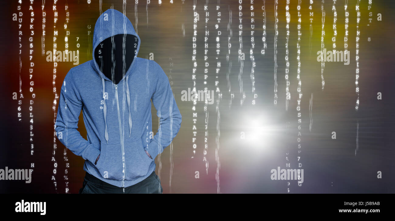 Robber in gray hoodie with hands in pockets against dark background ...