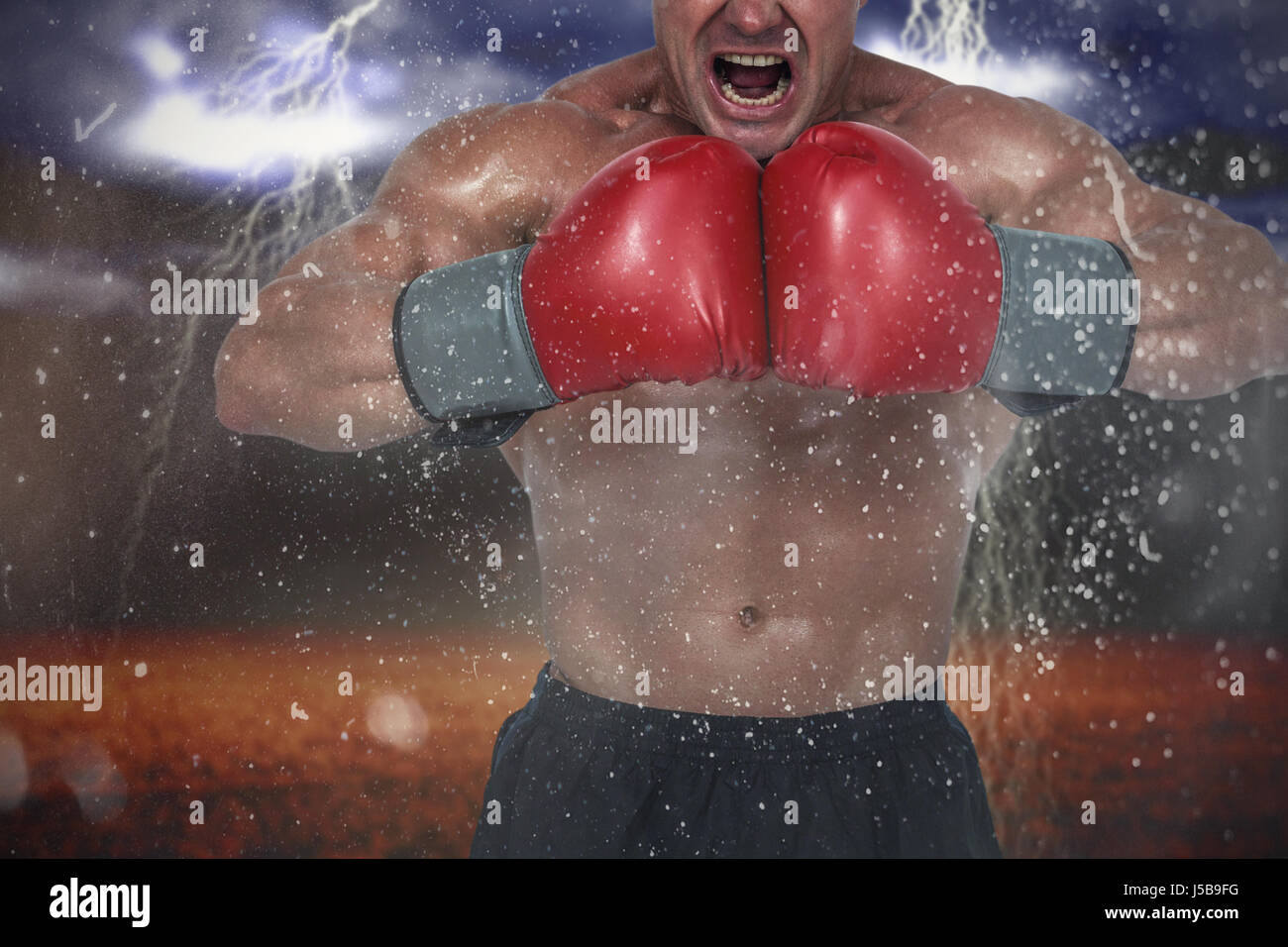 Aggressive boxer flexing muscles against splashing of powder Stock ...