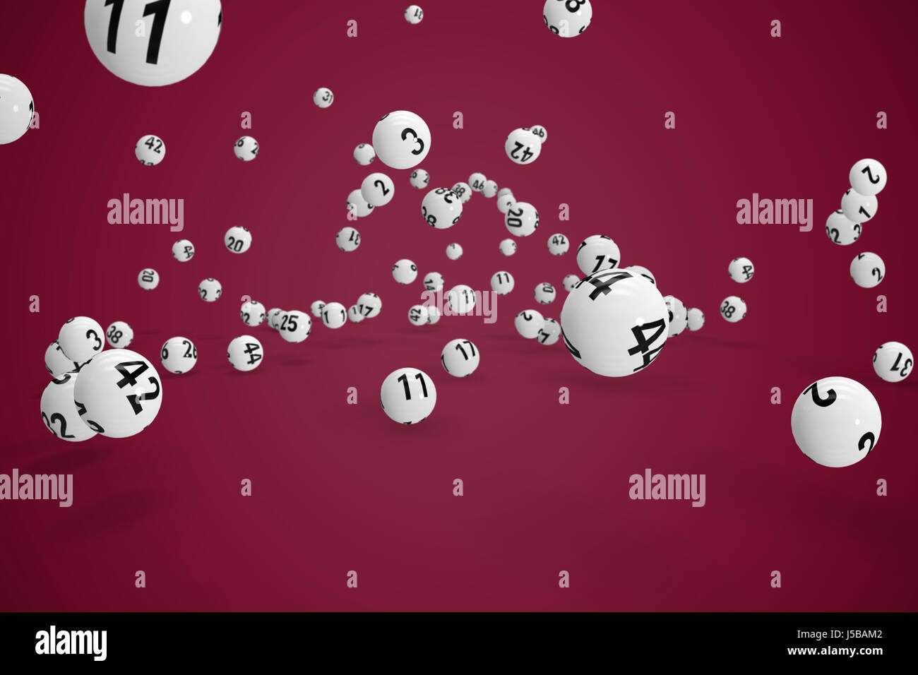 Falling lottery balls against pink background Stock Photo - Alamy