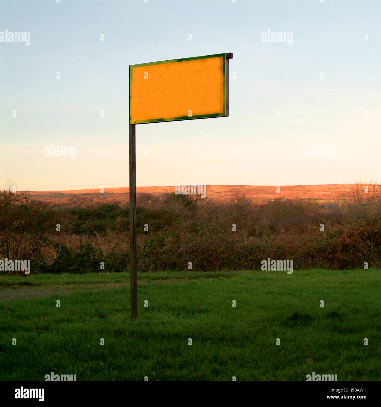 yellow shield in landscape 1 Stock Photo - Alamy