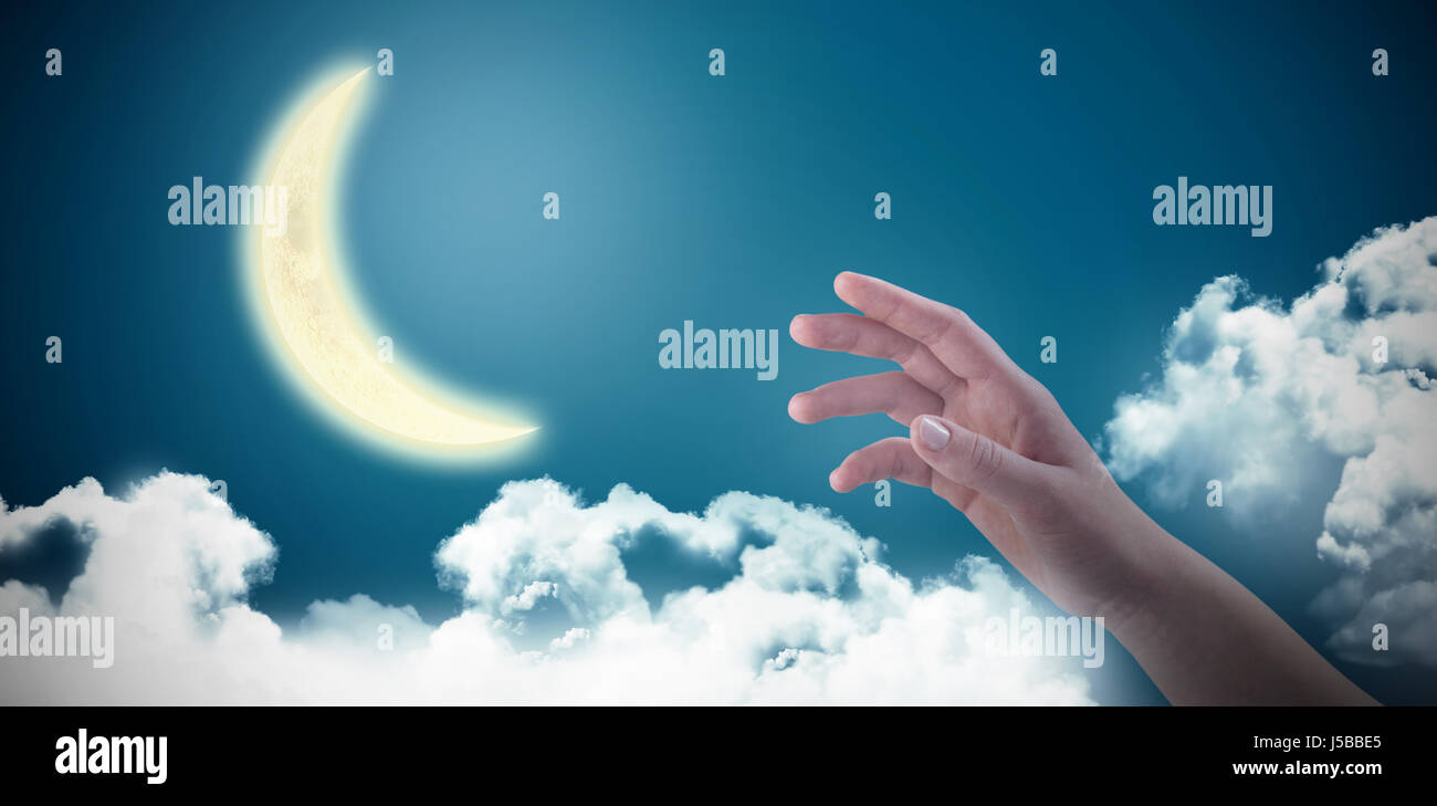 Close-up of cropped hand on white background against dark blue ...