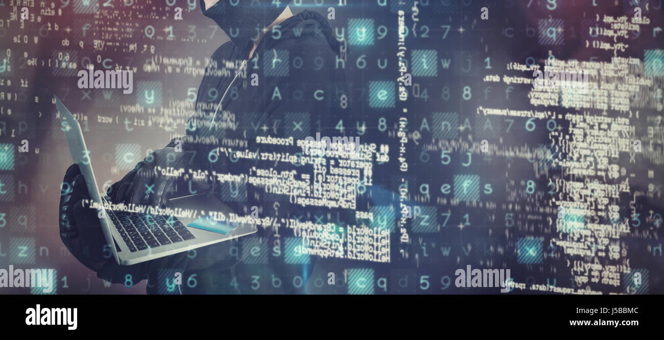 Female hacker using laptop against grey tile design Stock Photo - Alamy