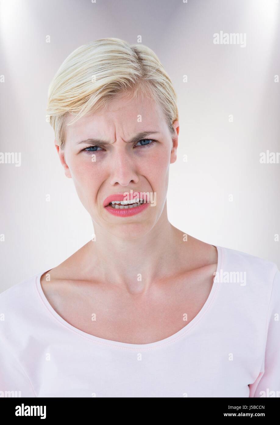 Digital composite of Woman with angry face against white background ...