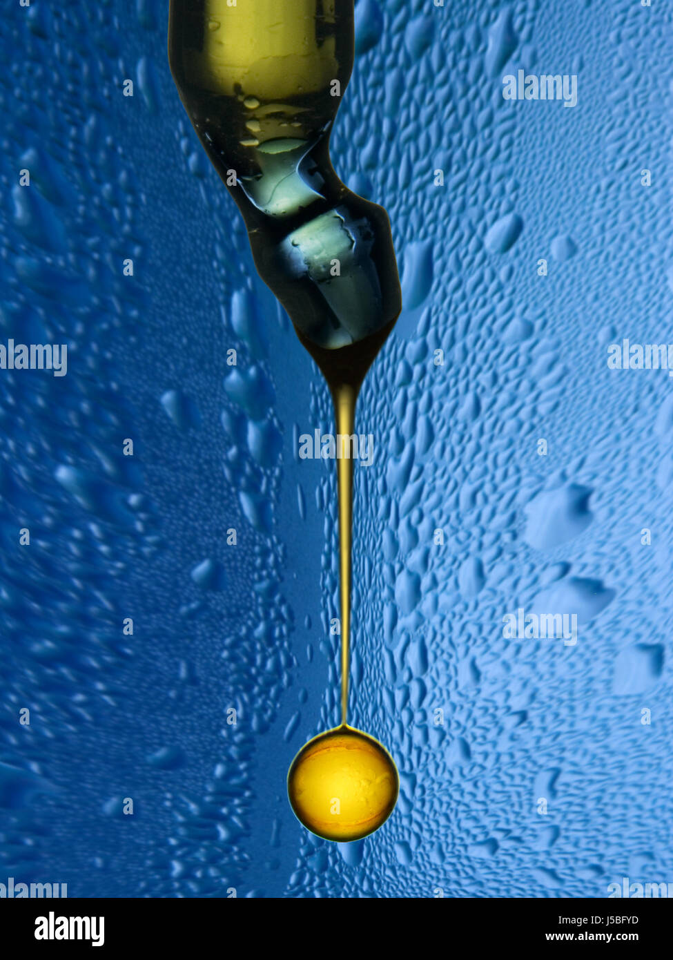 pipette with oil drops Stock Photo - Alamy