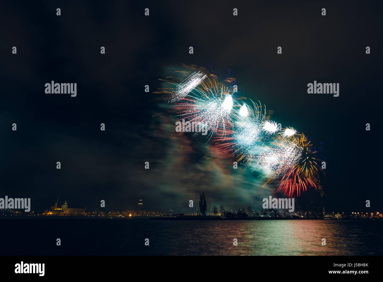 Colored New Year fireworks in centre of Riga Stock Photo - Alamy
