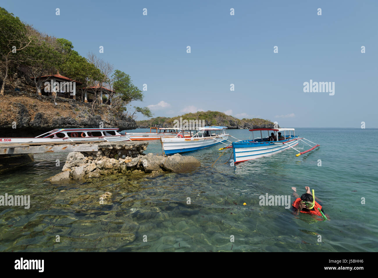 Quezon Island, Philippines - April 12, 2017: A tourist snorkel on the ...