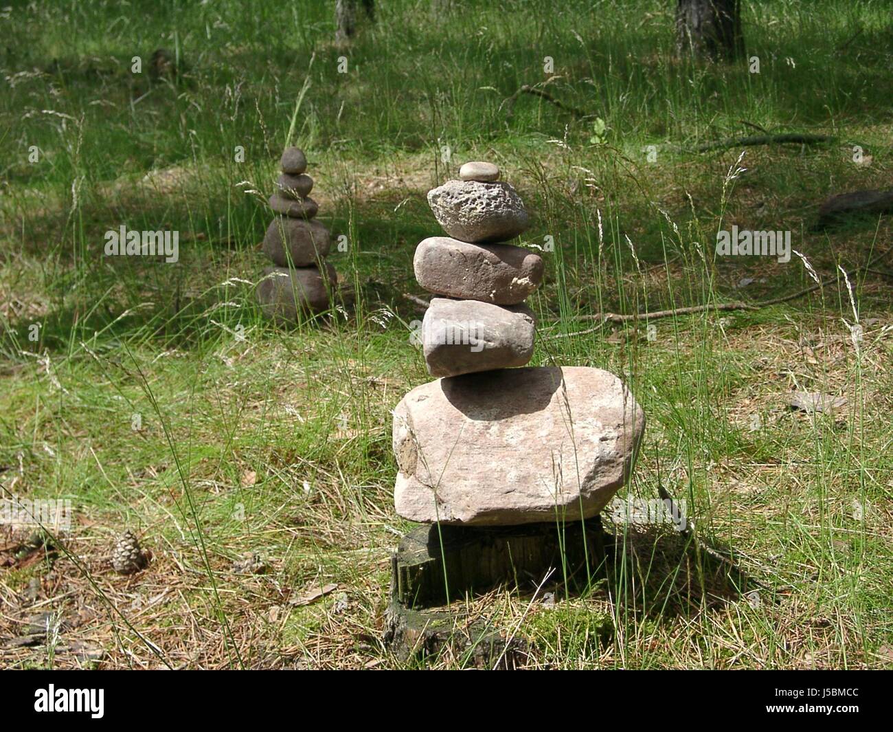 stone float stack meadow grass lawn green levitation forest nature ...
