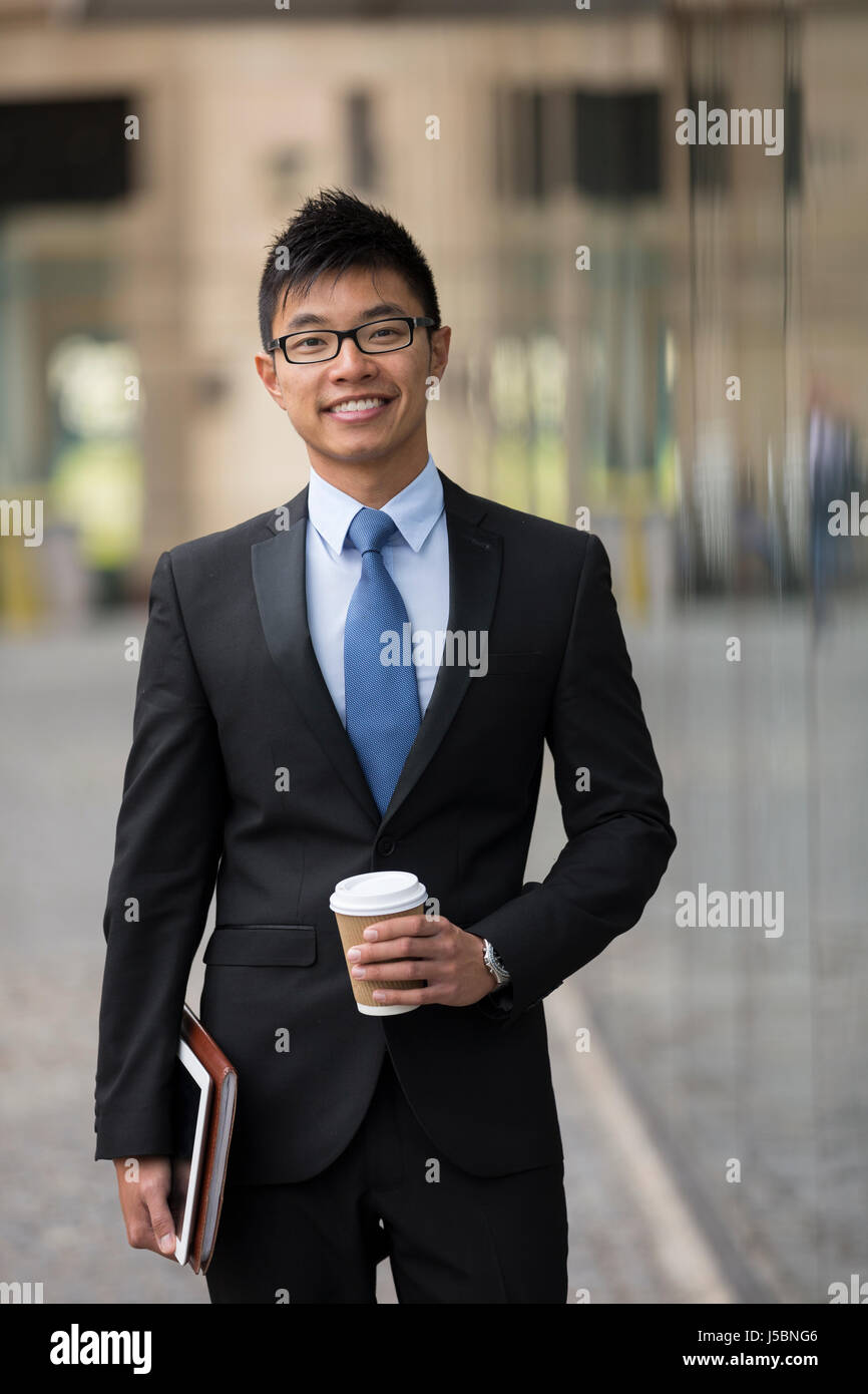Smiling chinese businessman hi-res stock photography and images - Alamy