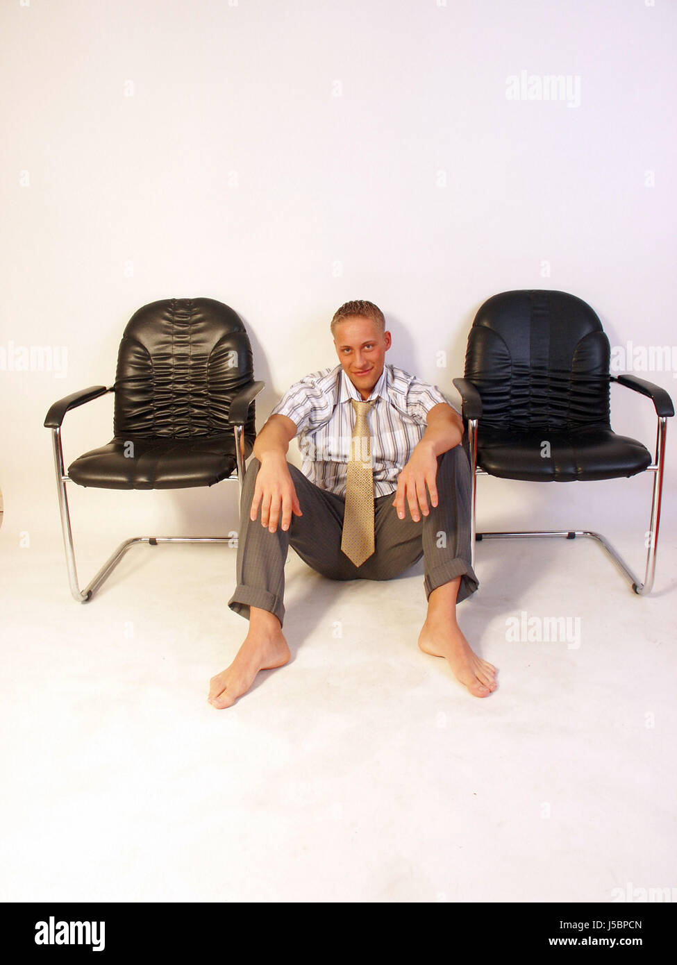 between the chairs Stock Photo - Alamy