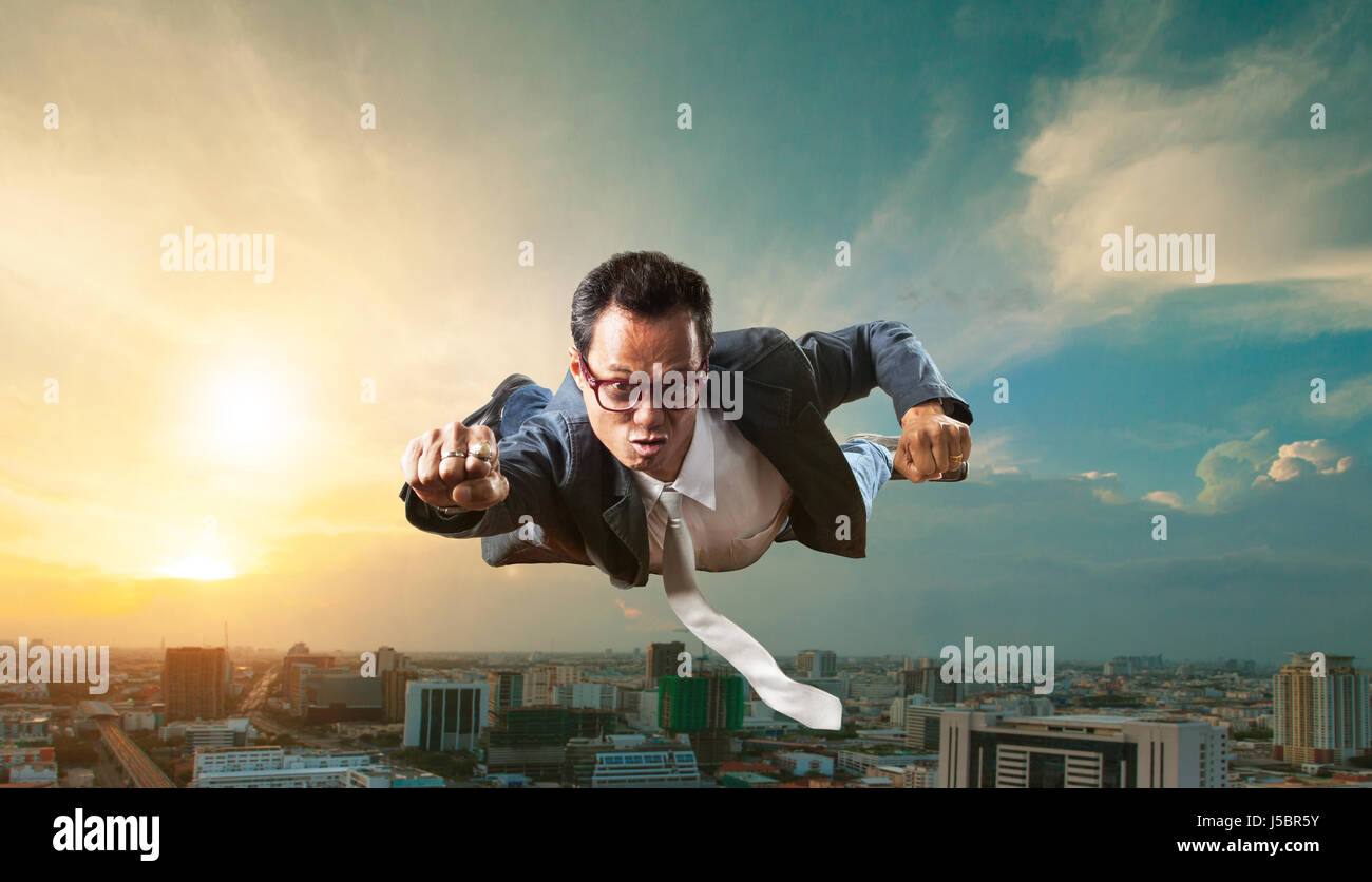 business man flying over skyscraper for business successful and ...