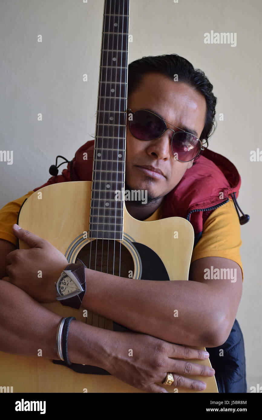 Hugging Guitar High Resolution Stock Photography and Images - Alamy