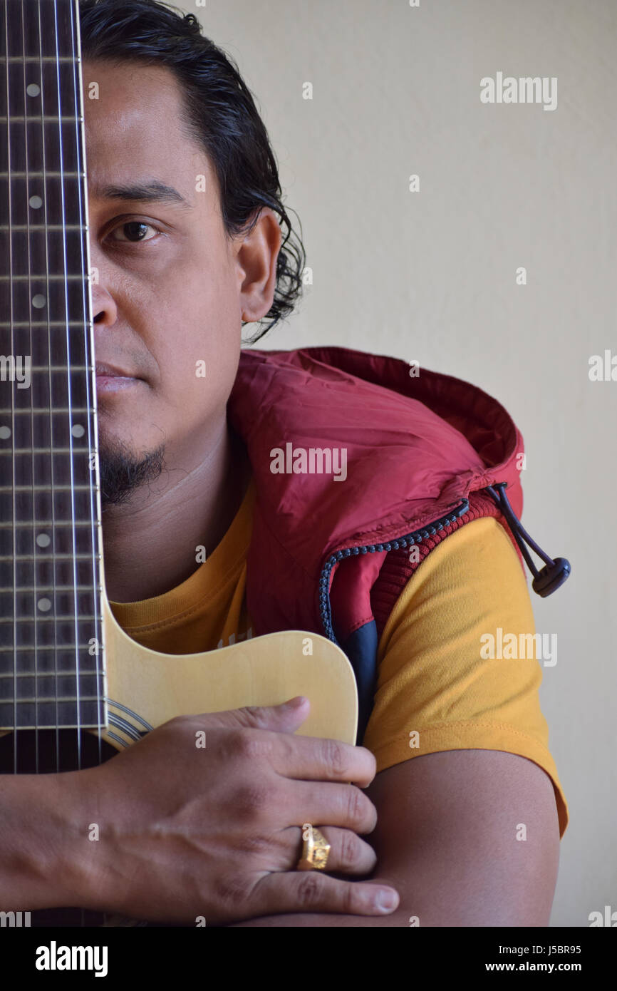 Hugging Guitar High Resolution Stock Photography and Images - Alamy