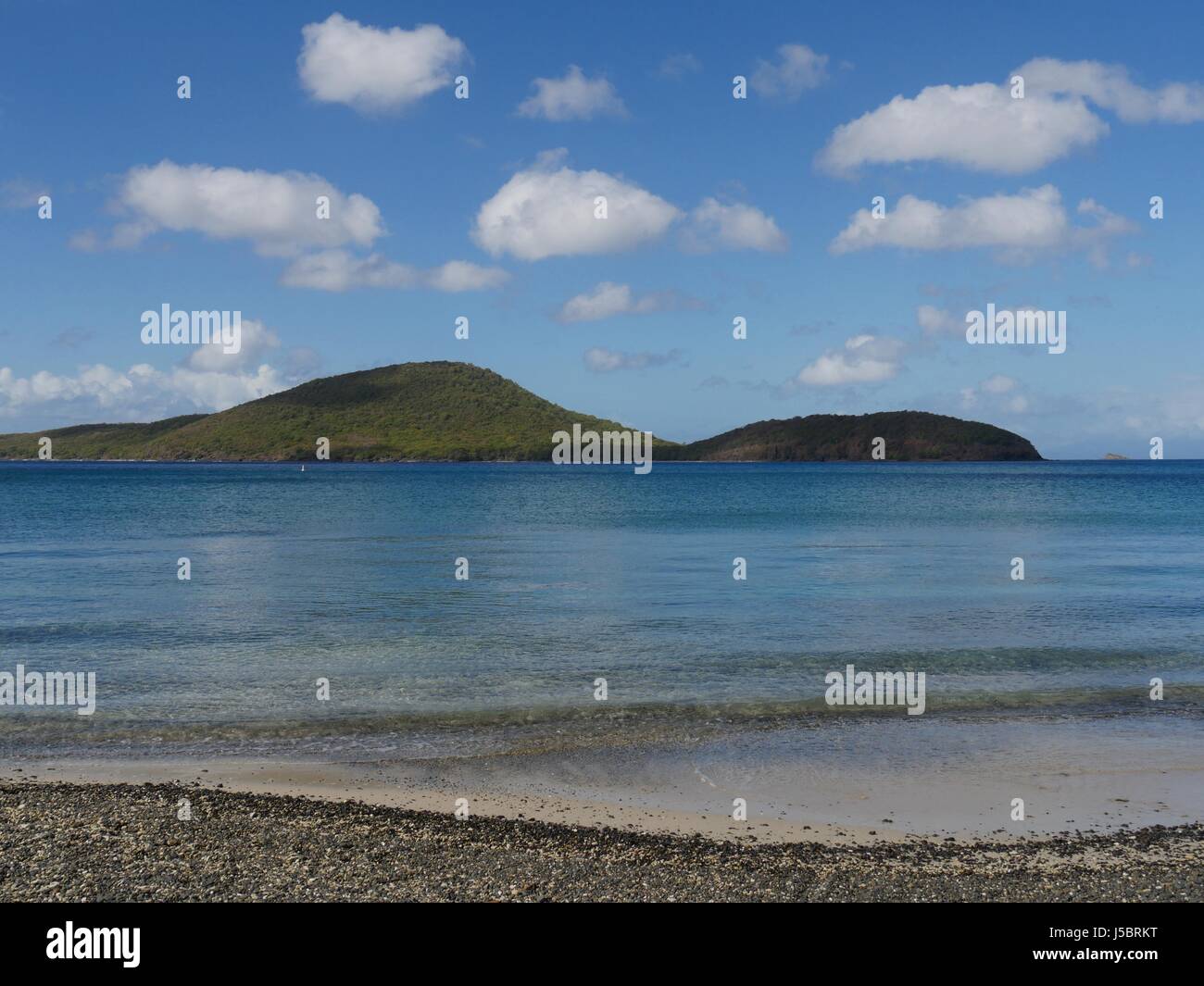 Zoni Beach, Culebra, Puerto Rico White cotton wads of clouds hang over ...