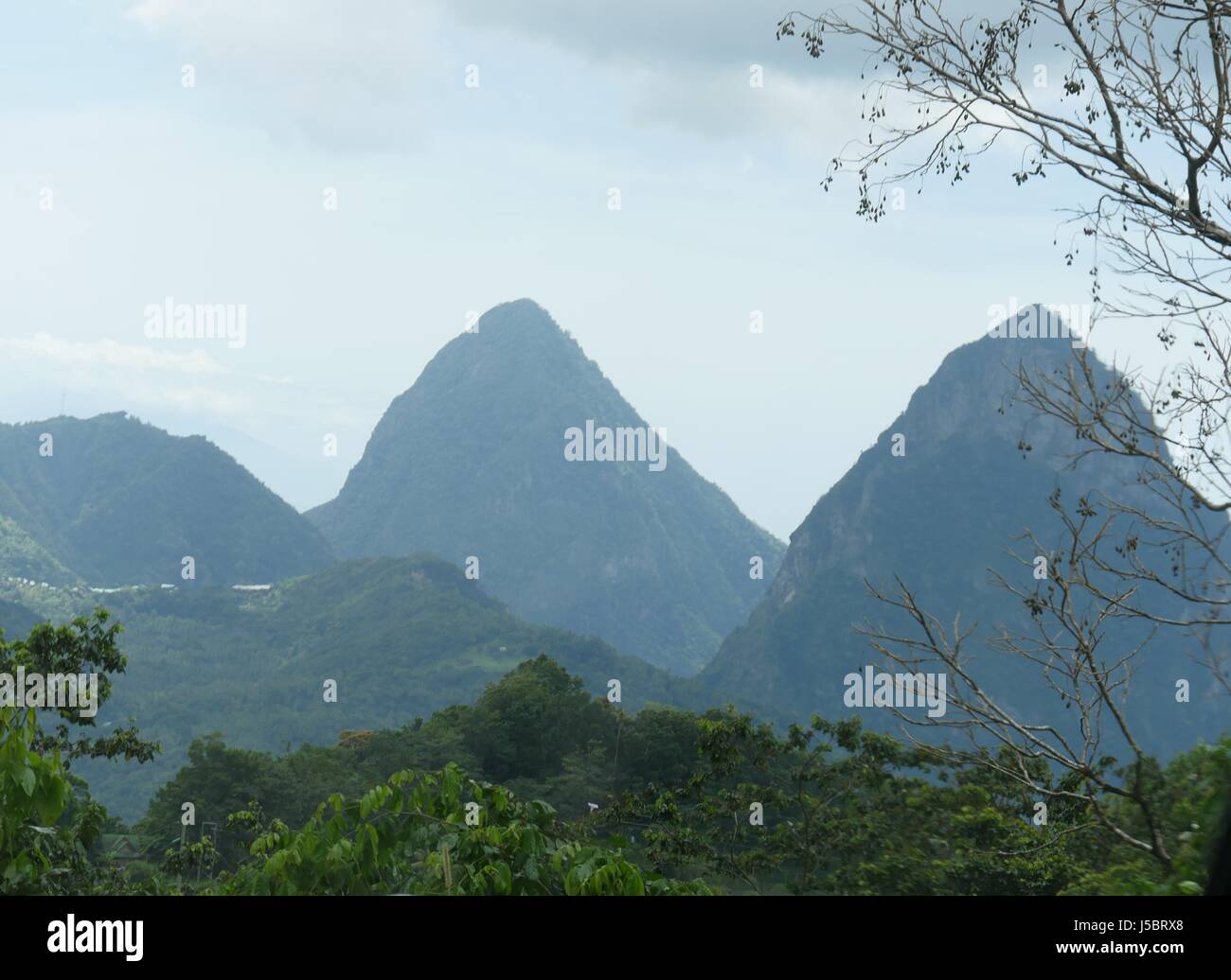 The Pitons from a distance, Soufrière, St. Lucia The Piton Mountains is ...
