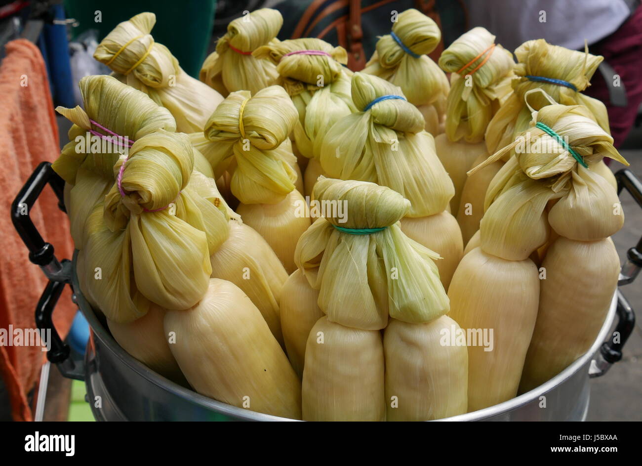 Boiled, ready to eat corn is sold in the sidewalks of Asian countries ...