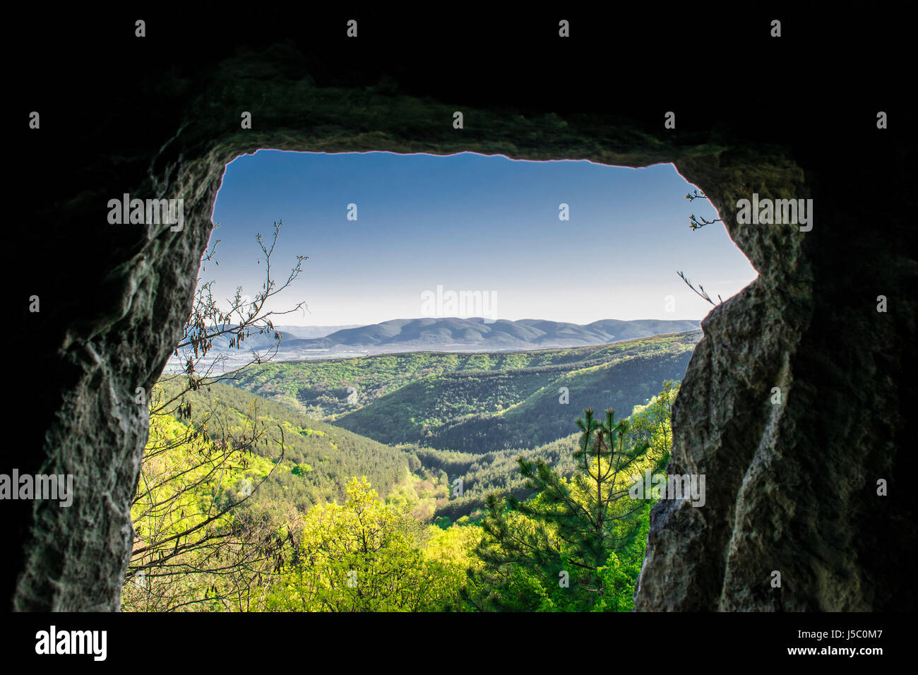A wonderful view at the Balkan Mountains from a mysterious cave, hidden ...