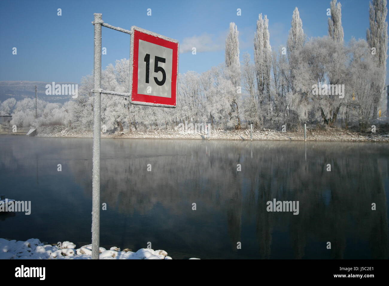 sign signal winter navy ice traffic sign icy snow river water flussufer ...