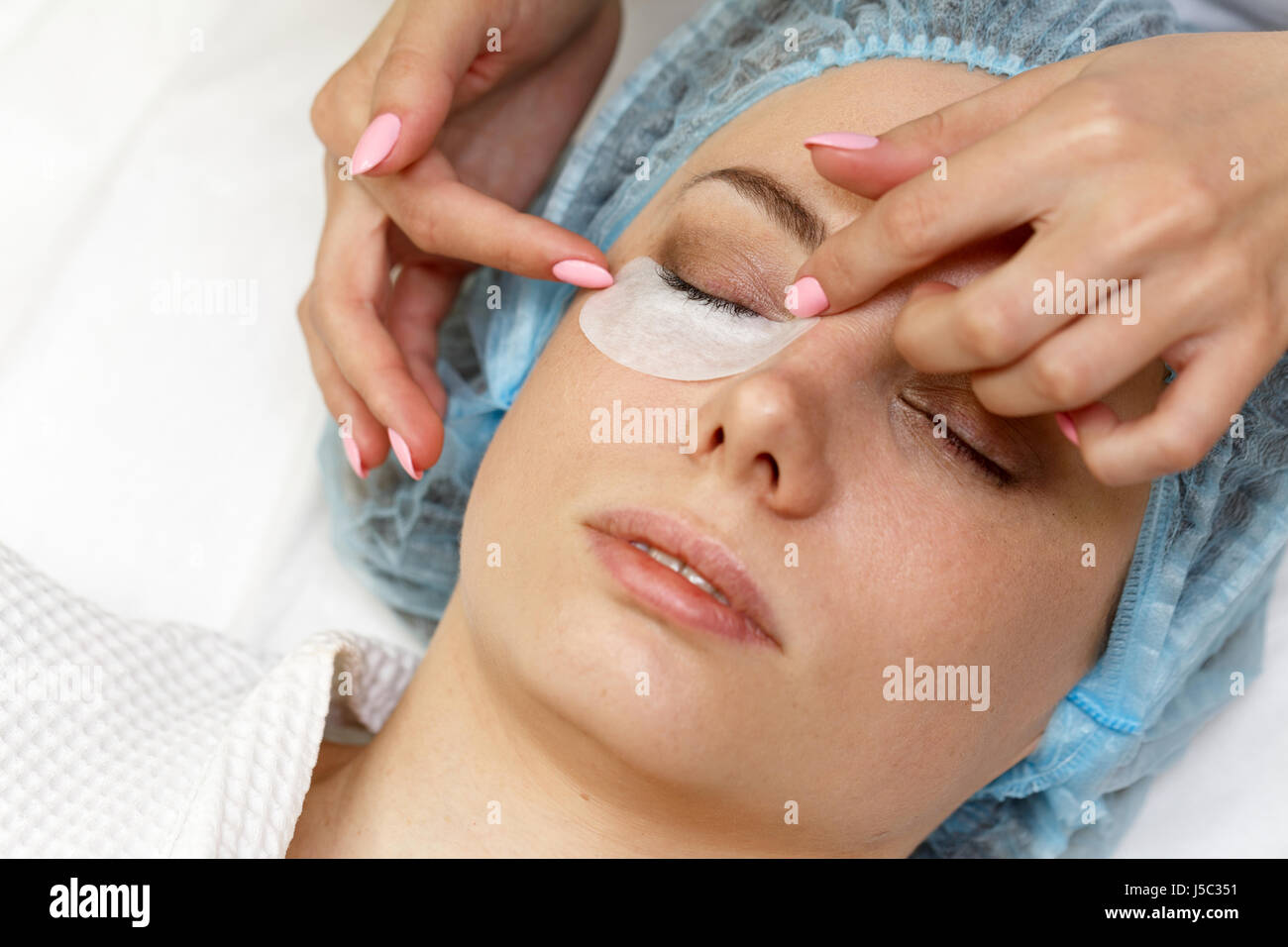 Beauty salon. Preparation of eyelashes of the lower eyelid before the ...