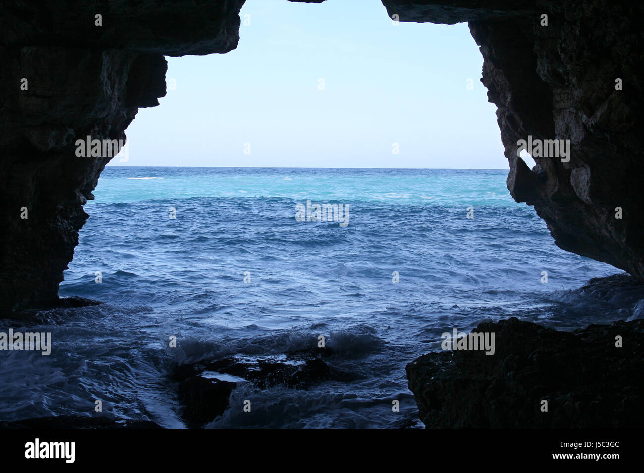 blue shine shines bright lucent light serene luminous cave arch beach ...
