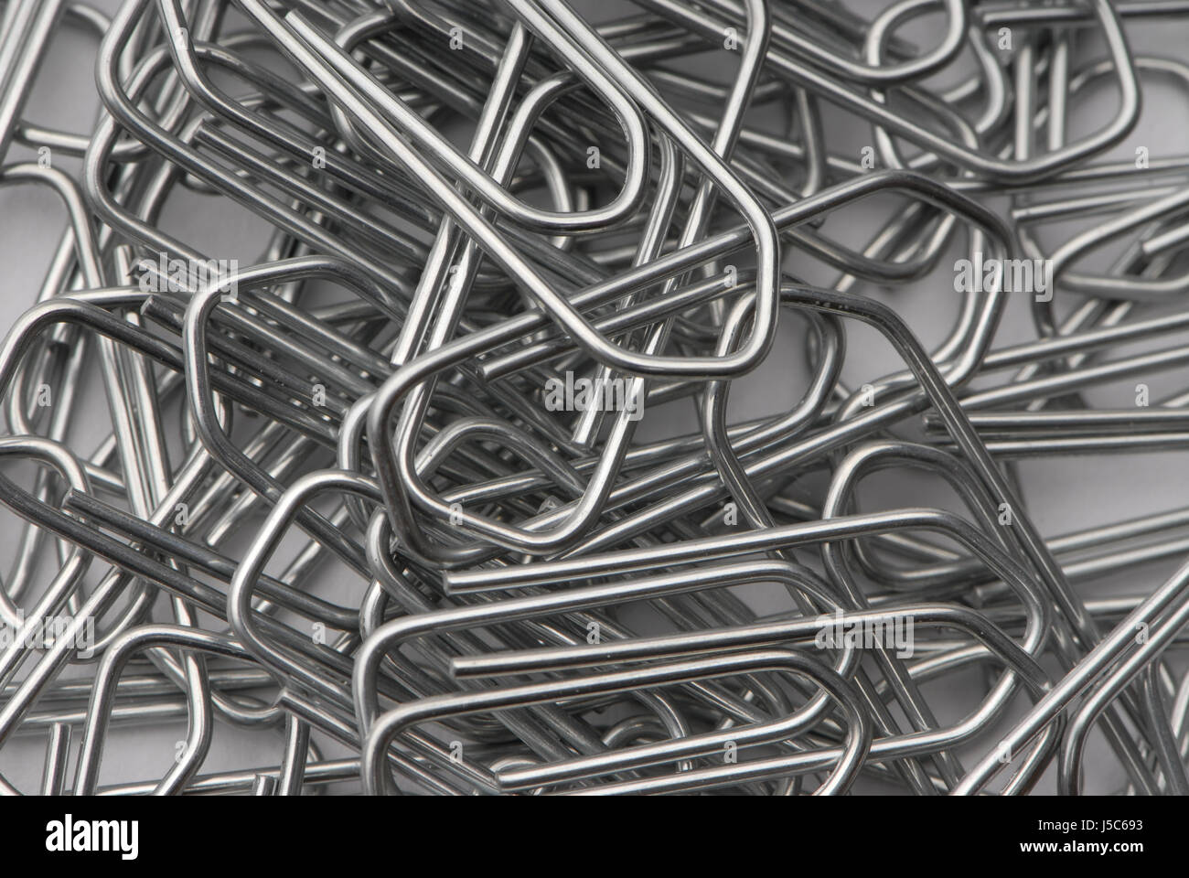 paperclip office desk chaos Stock Photo - Alamy