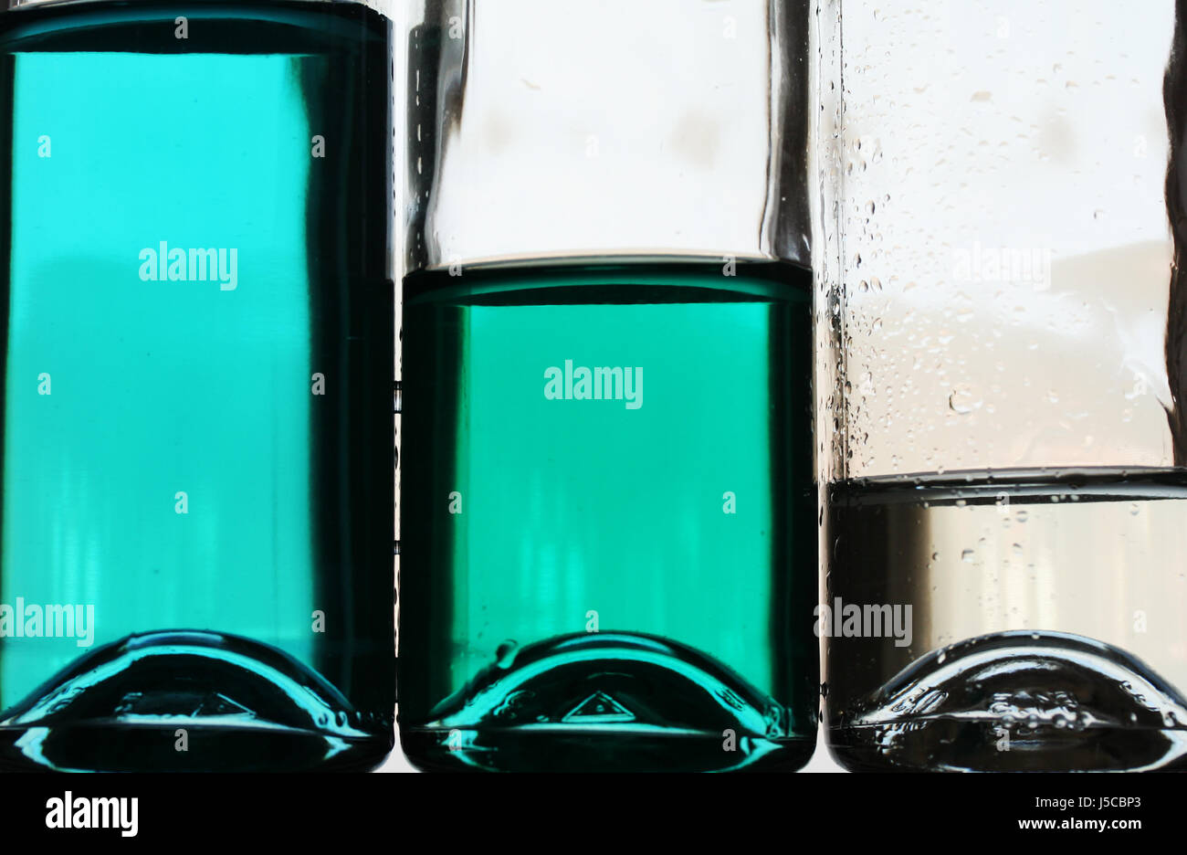 blue liquid green vessel bottles passing light vessels fluid water drop ...