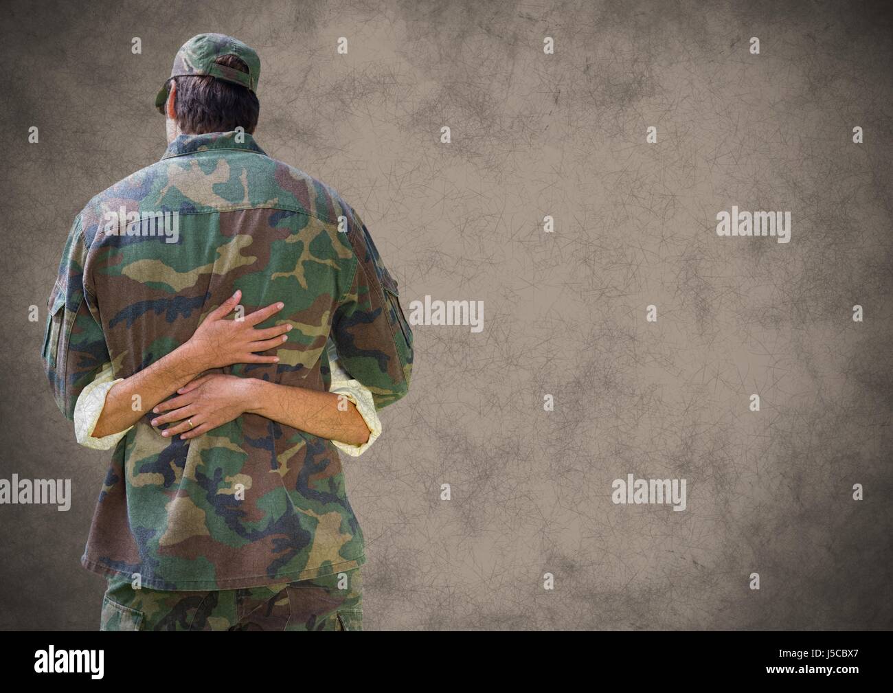 Digital composite of Back of soldier hugging with grunge overlay ...