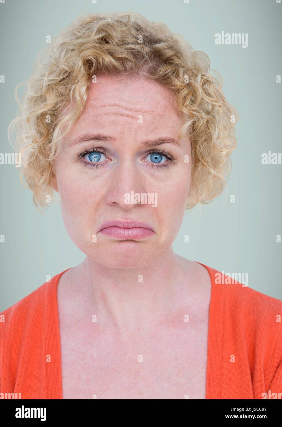 Digital composite of Woman pouting against light blue background Stock ...