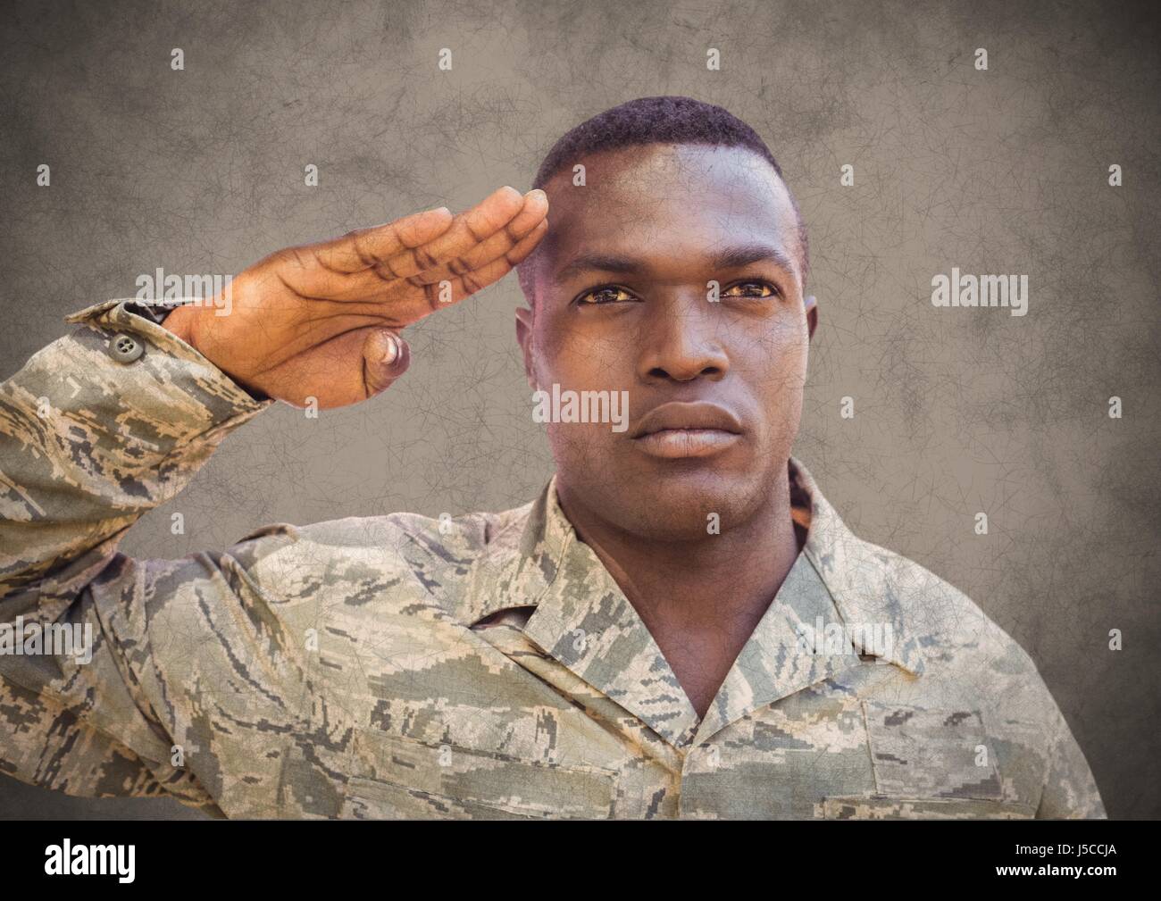 Digital composite of Soldier saluting against brown background with ...