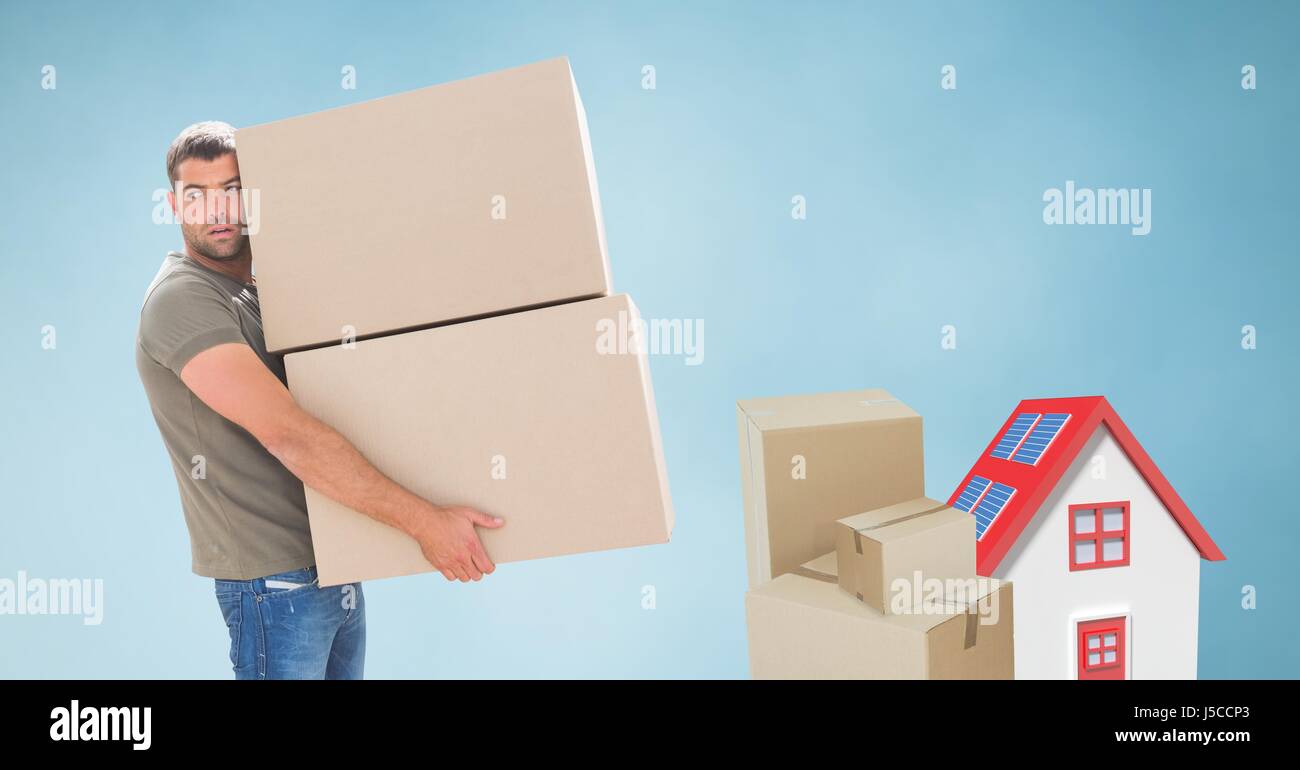 Digital composite of Delivery man carrying heavy parcels by house Stock ...