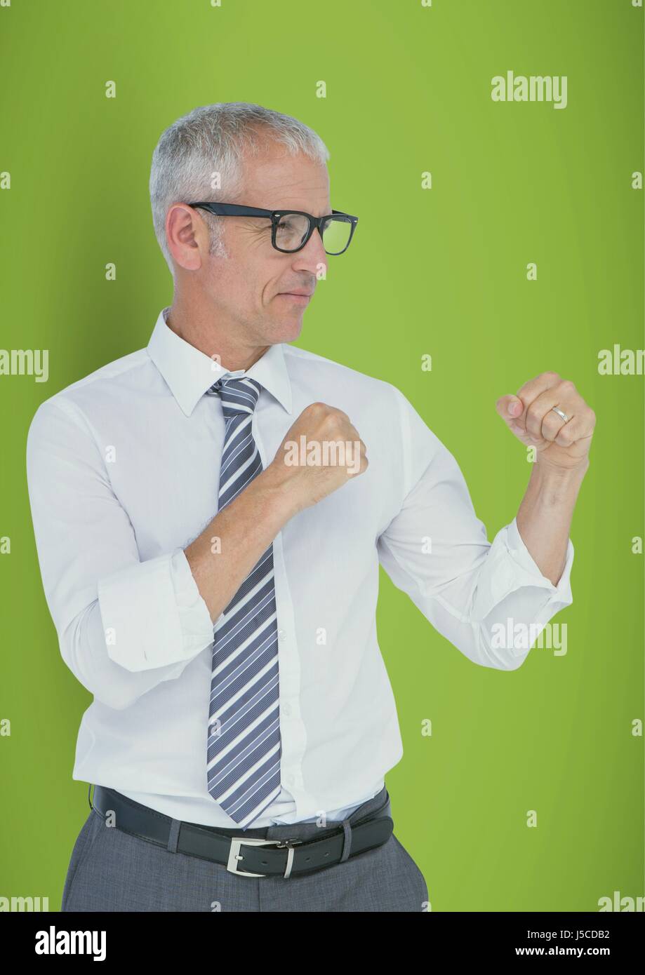 Digital composite of Confident businessman standing in fighting stance ...