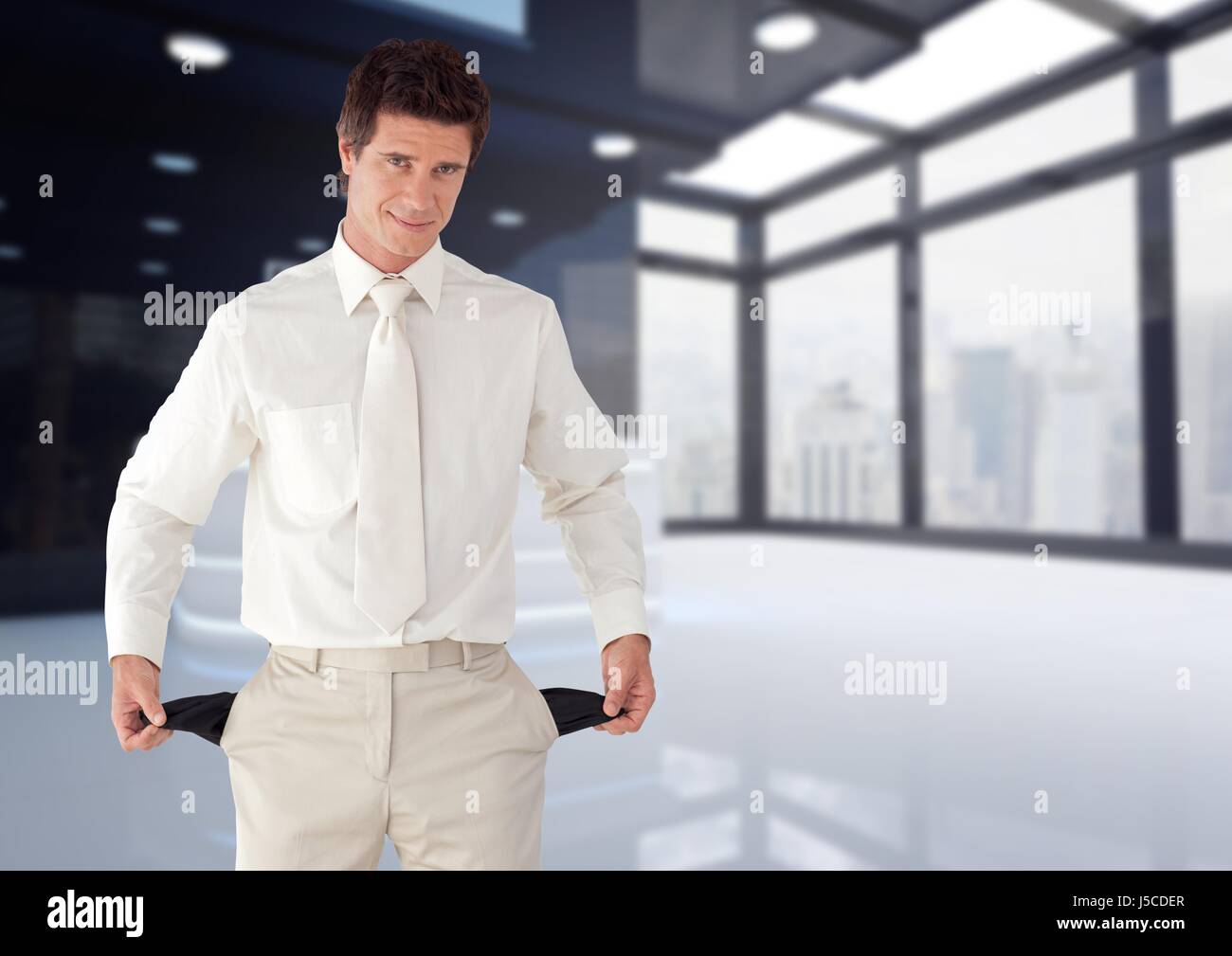 Digital composite of Businessman showing empty pockets Stock Photo - Alamy