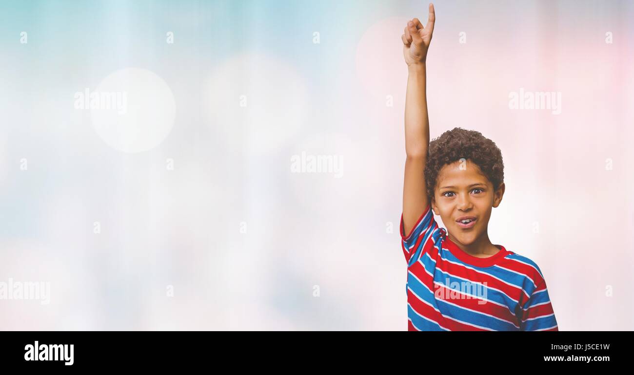 Digital composite of Happy boy raising hand to answer Stock Photo - Alamy