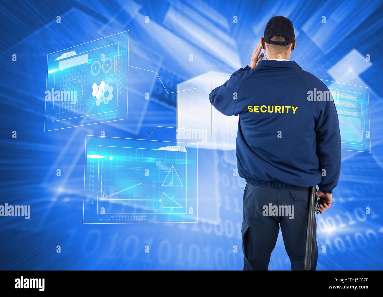 Digital composite of Rear view of security guard against screen Stock ...
