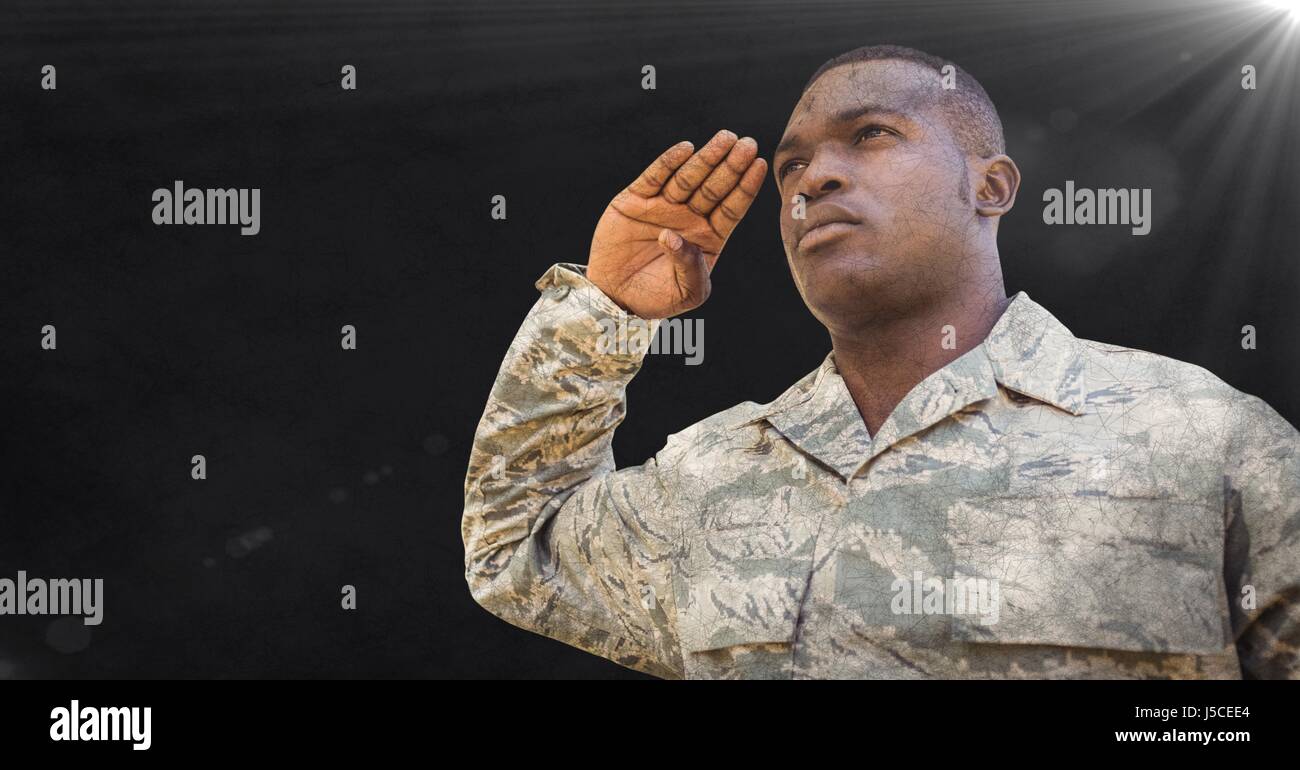 Digital composite of Soldier saluting against black background with ...
