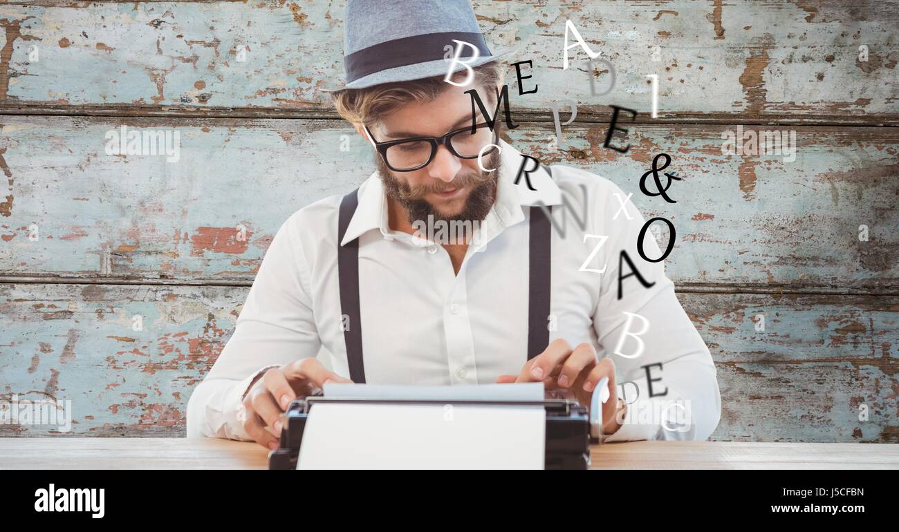 Digital composite of Male hipster using typewriter with alphabets ...