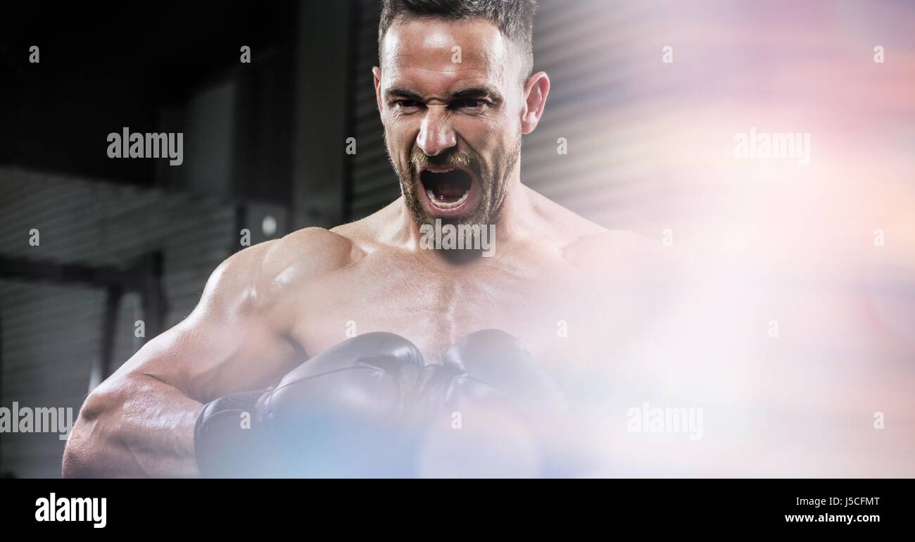 Digital composite of Angry boxer screaming at gym Stock Photo - Alamy