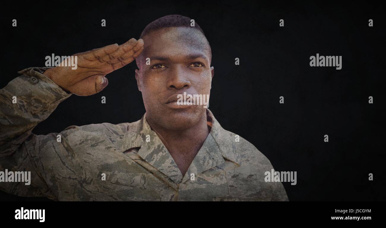 Digital composite of Soldier saluting against black background with ...