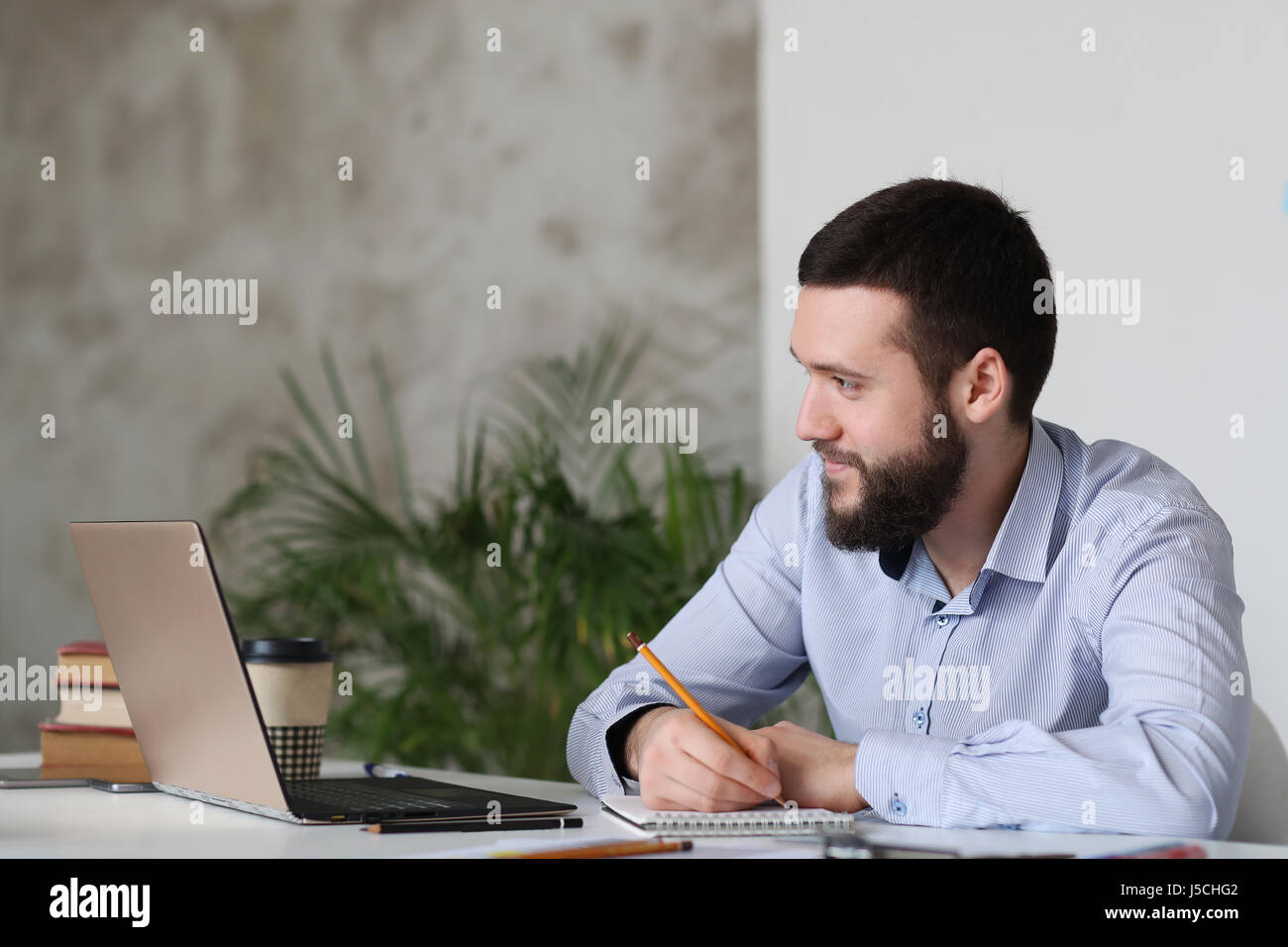 Man at work in the office Stock Photo - Alamy