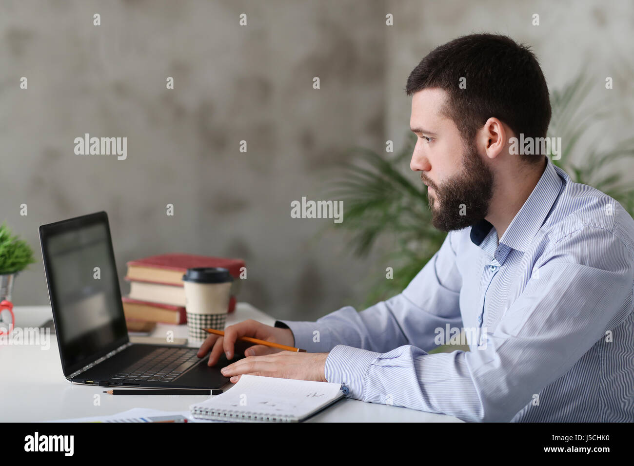 Man at work in the office Stock Photo - Alamy
