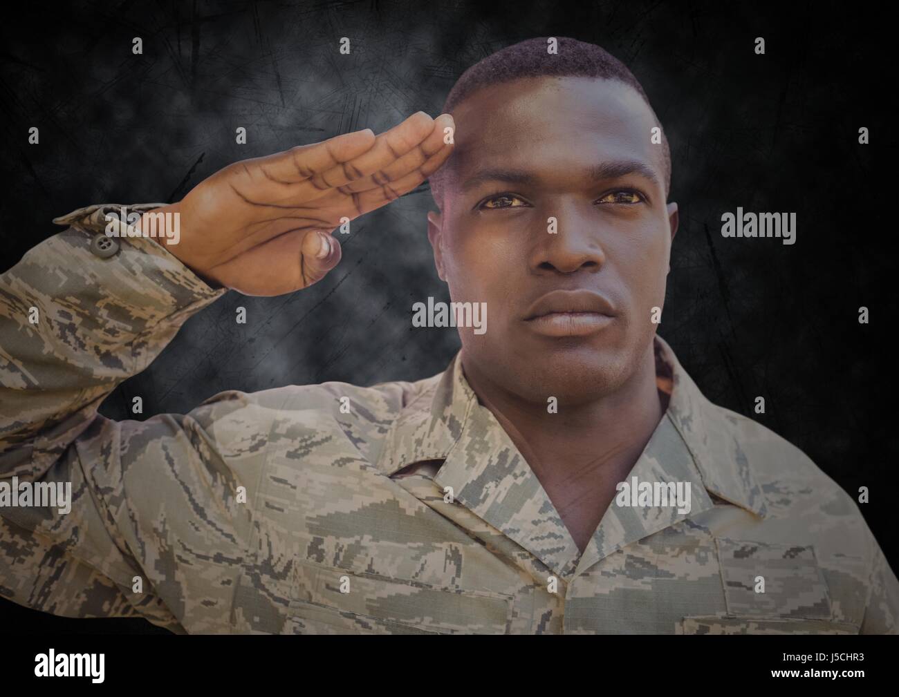 Digital composite of Soldier saluting against black grunge background ...