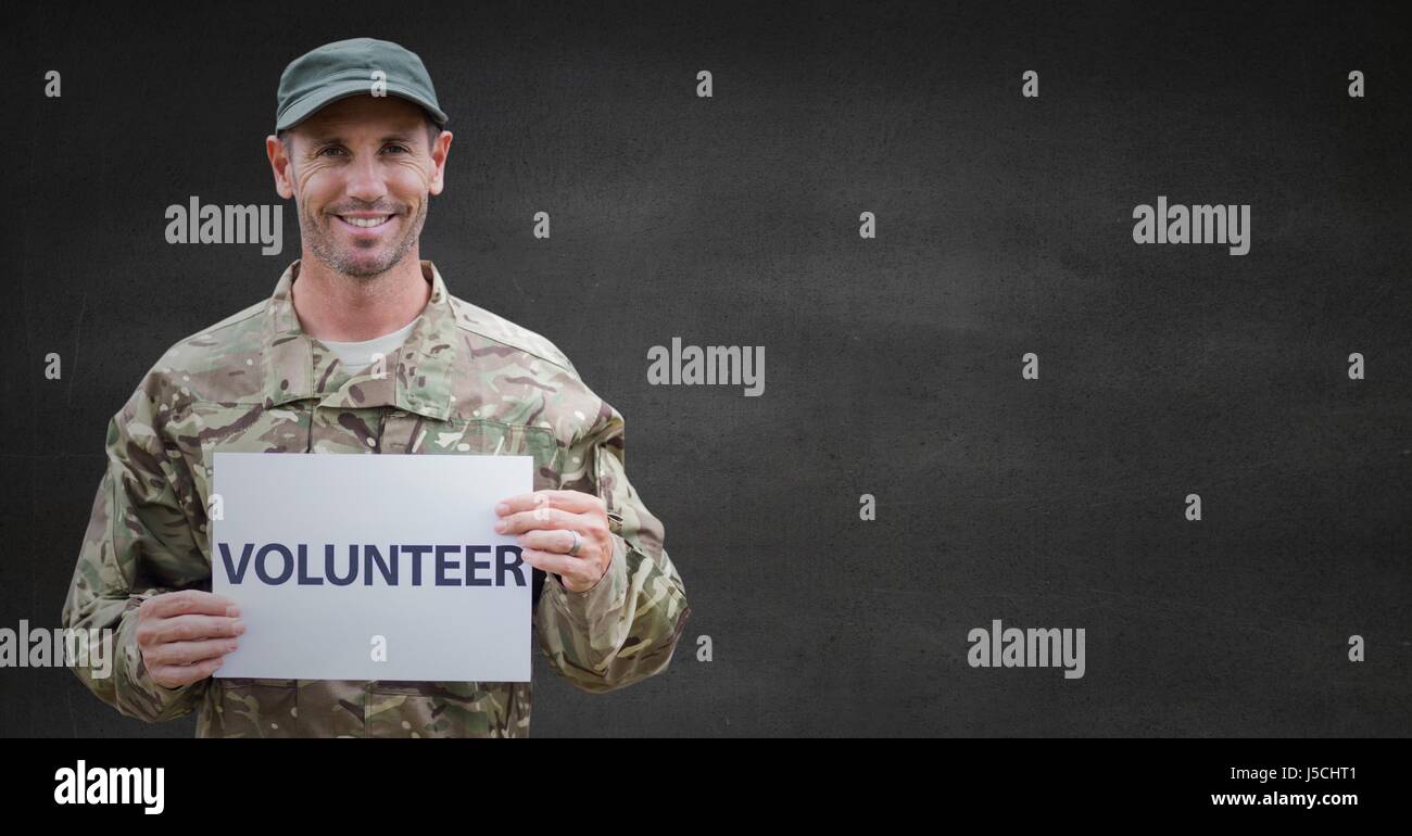 Digital composite of Soldier volunteer against grey wall Stock Photo ...