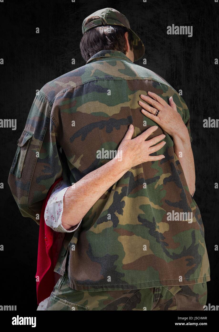 Digital composite of Back of soldier being hugged against black ...