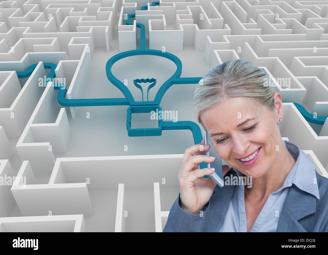 Digital composite of Businesswoman using smart phone against light bulb ...